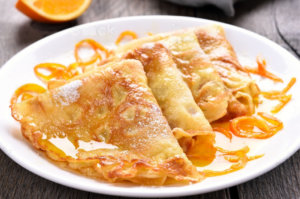 Crepas bañadas con miel de naranja